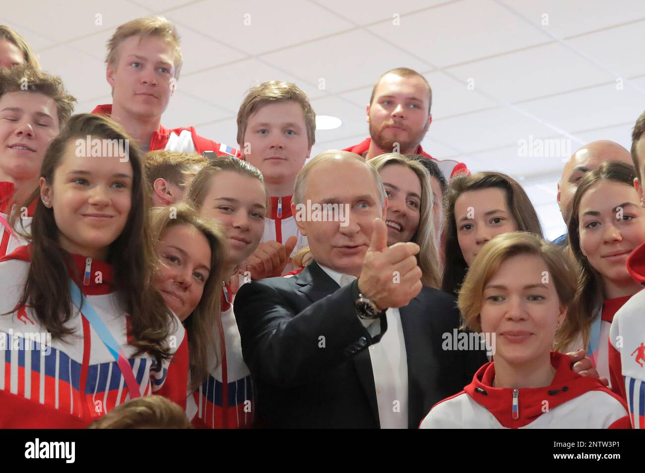 Russian President Vladimir Putin, center, poses for a photo with ...