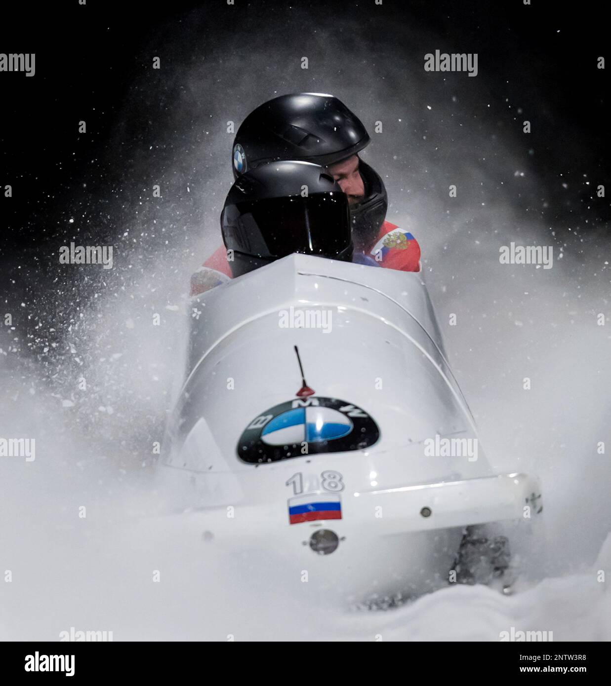 Russia's Maxim Andrianov, front, and Ilya Malykh come to a stop after ...