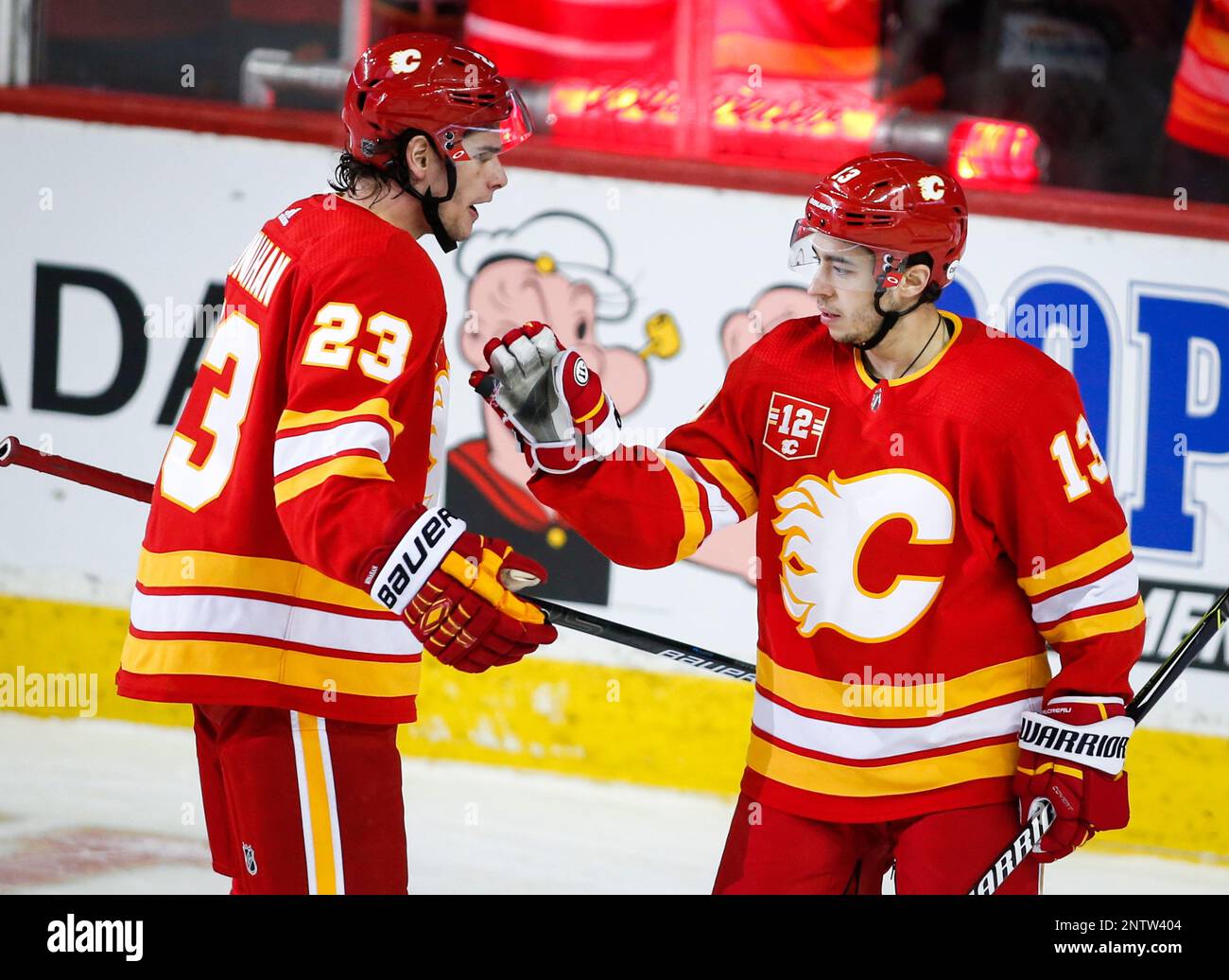 Calgary Flames' Sean Monahan, left, celebrates his goal with teammate ...
