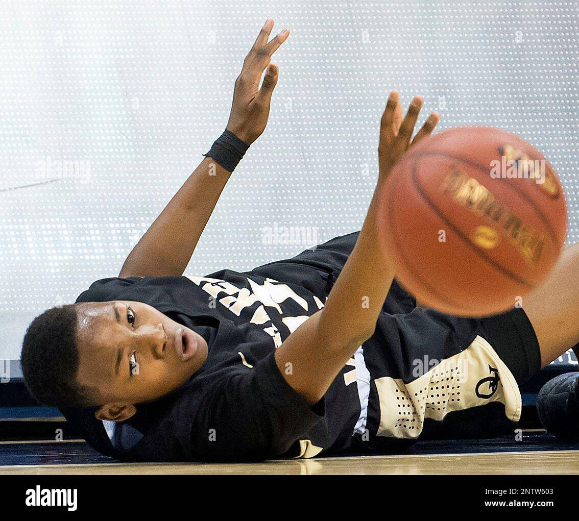 Quaker Valley's Adou Thiero dives for a loose ball against New Castle ...