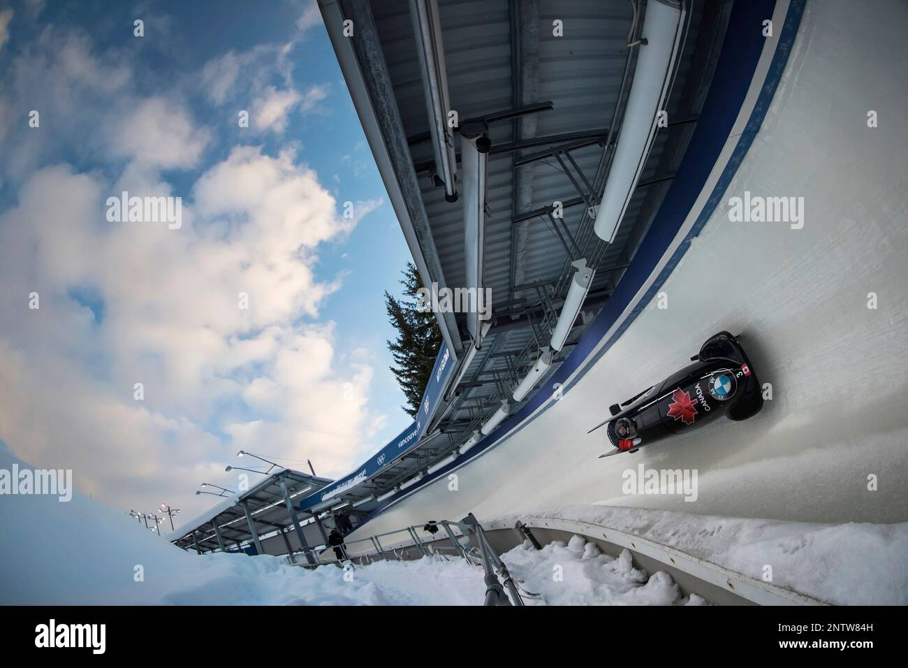 Canada's Chris Spring and Neville Wright race down the track on their ...