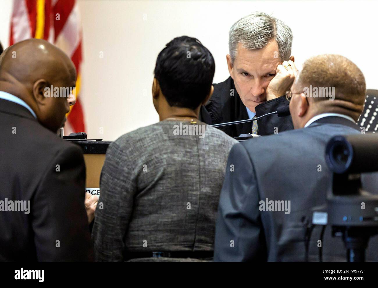 Circuit Judge Joseph Marx holds a bench conference with attorneys ...