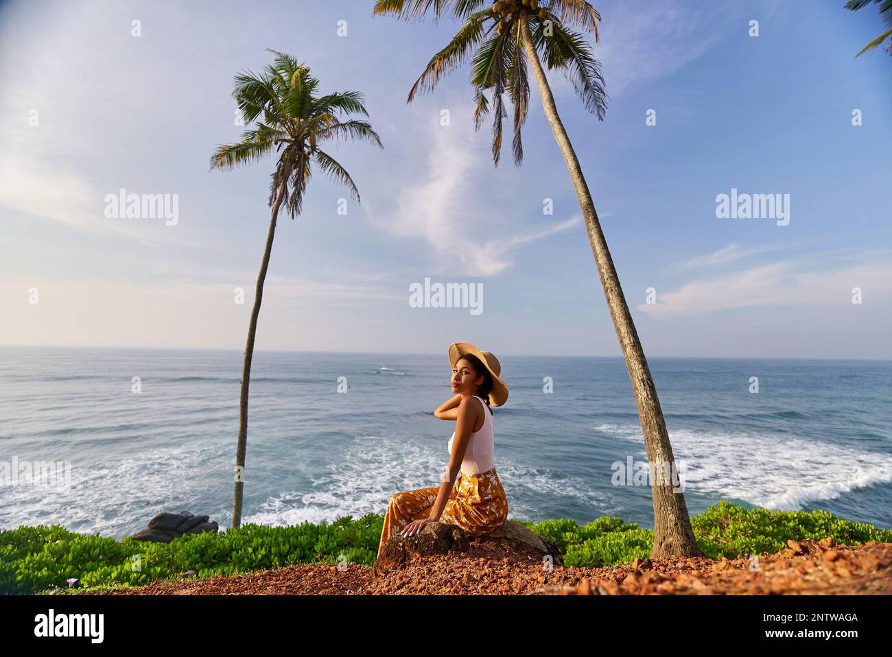 Young african female model posing in colorful clothes at scenic ...