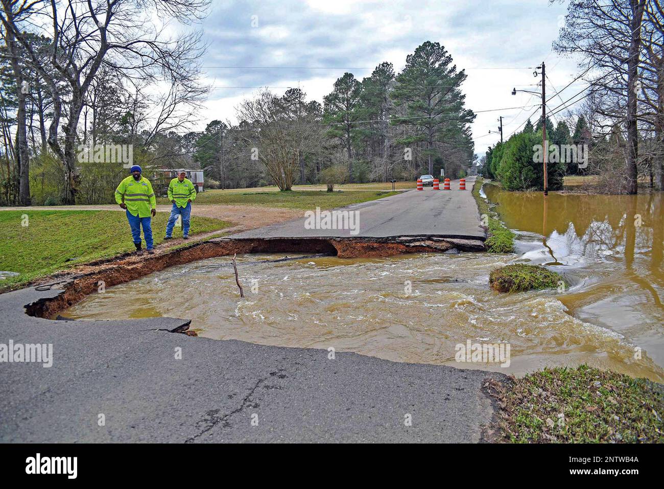 In this Tuesday, Feb. 26, 2019 photo, city workers assess damage caused ...