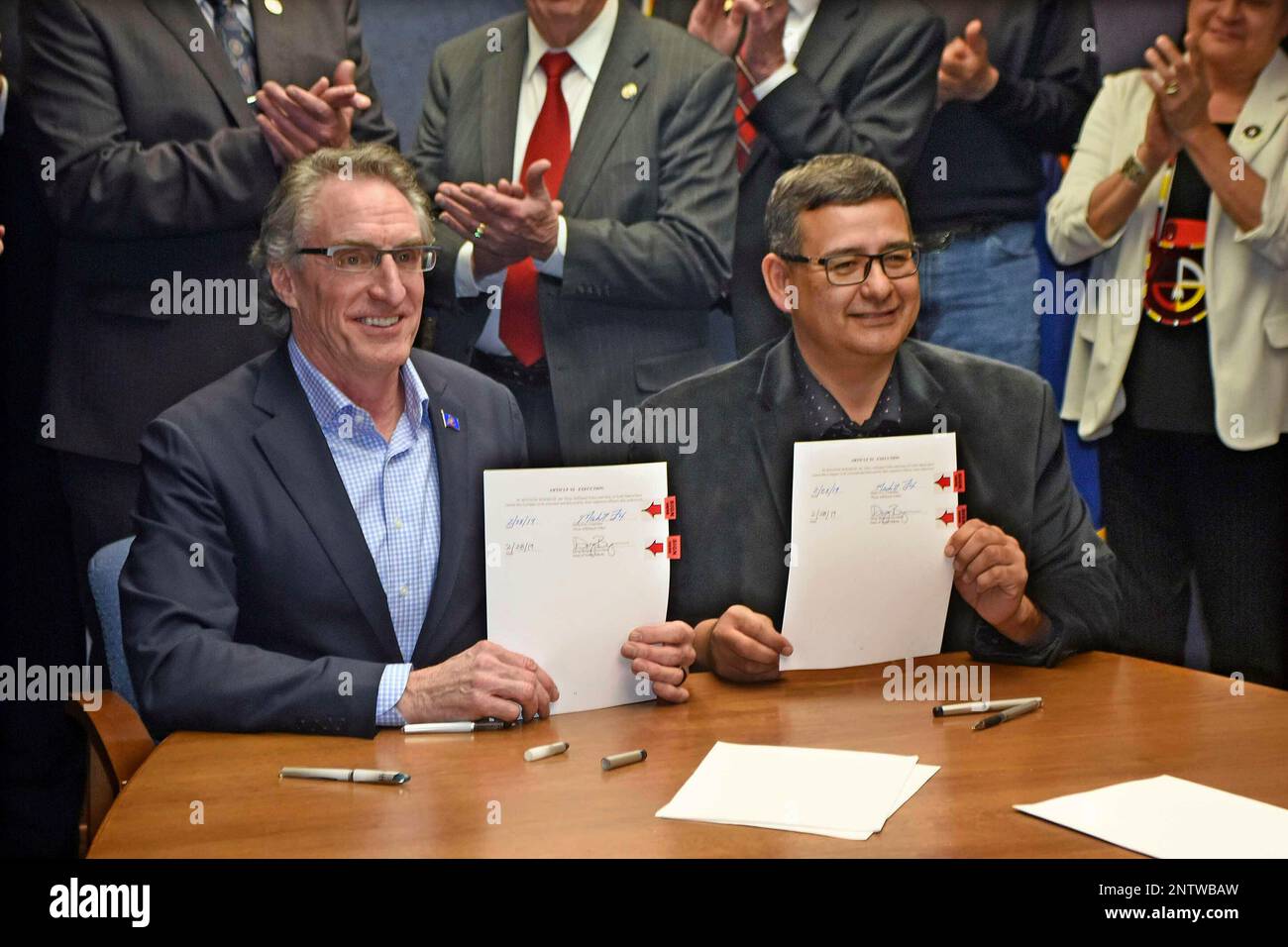 Applause broke out in a room filled with officials representing state ...