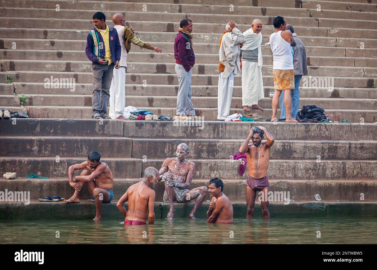 Pilgrims praying and bathing, in the ghats of Ganges river, Varanasi ...
