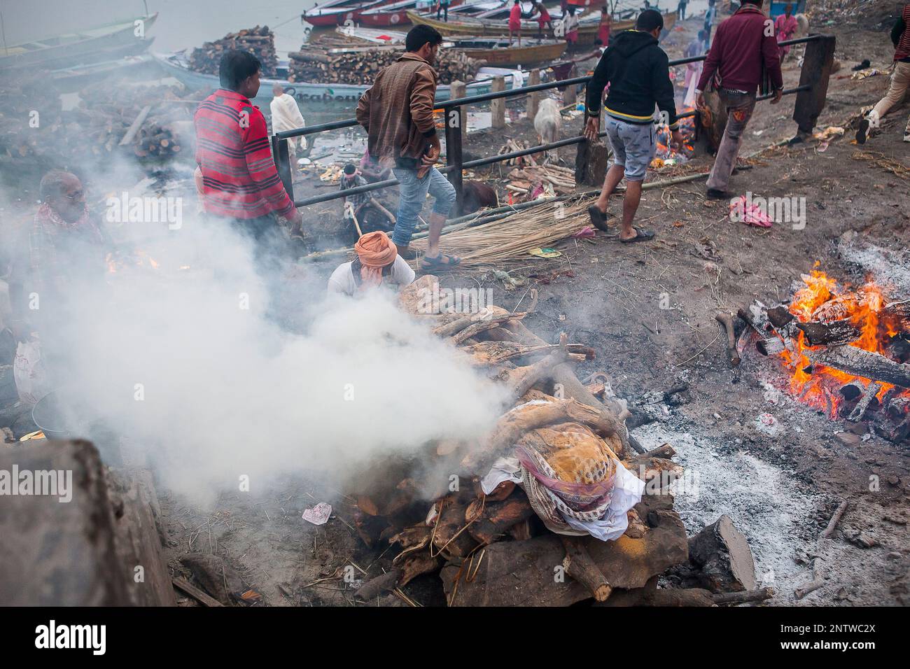 Cremation of a body, in Manikarnika Ghat, the burning ghat, on the ...