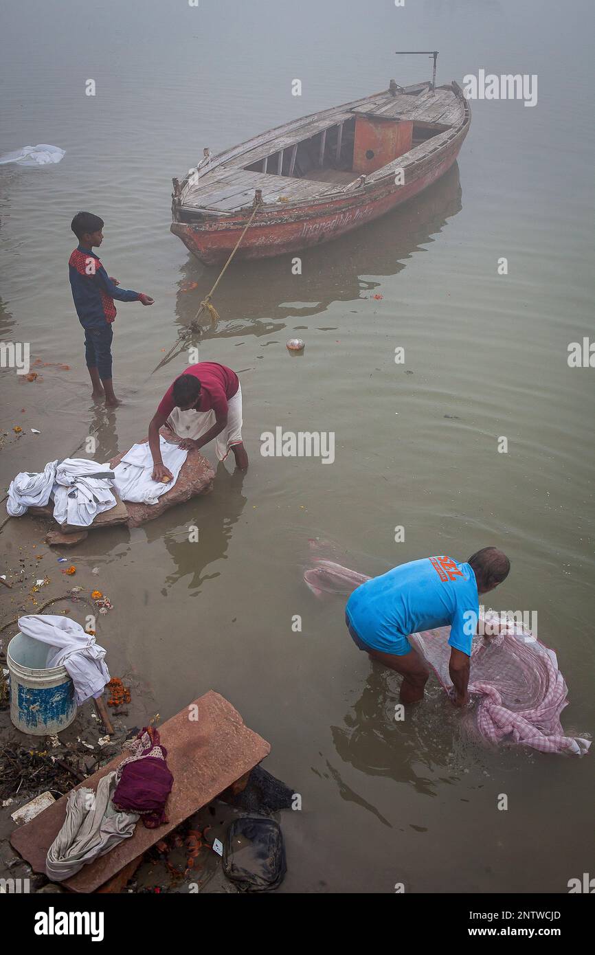 workers washing clothes, in Ganges river, Varanasi, Uttar Pradesh ...