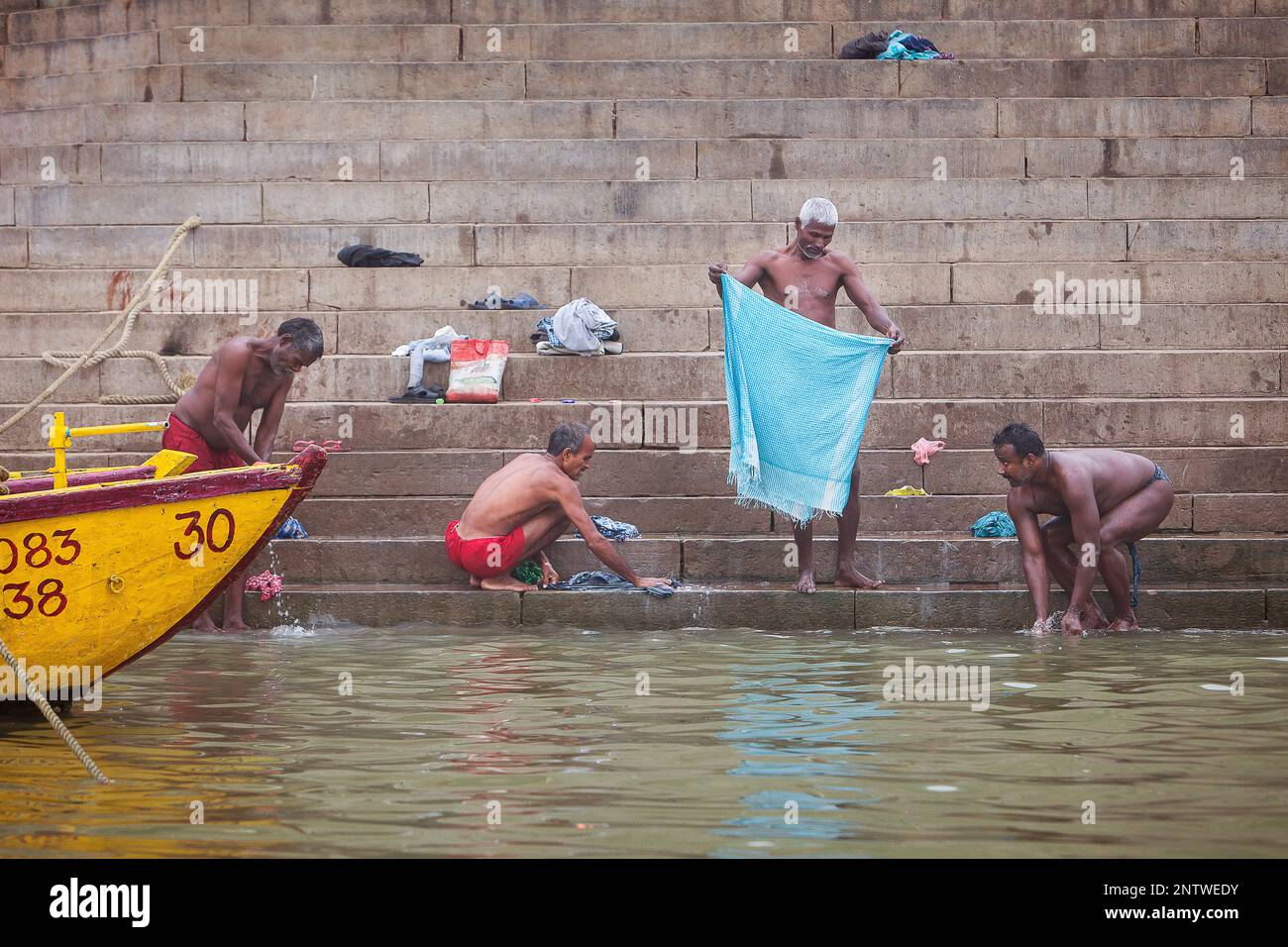 Pilgrims praying and bathing, in the ghats of Ganges river, Varanasi ...
