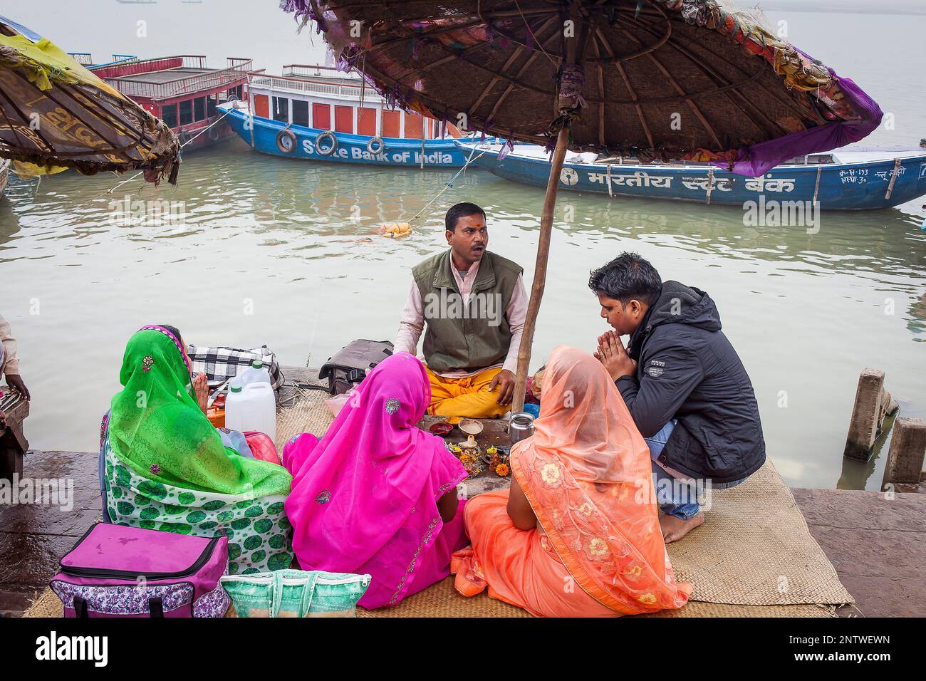 Pilgrims and a Pandit (holy man and priest who performs ceremonies ...