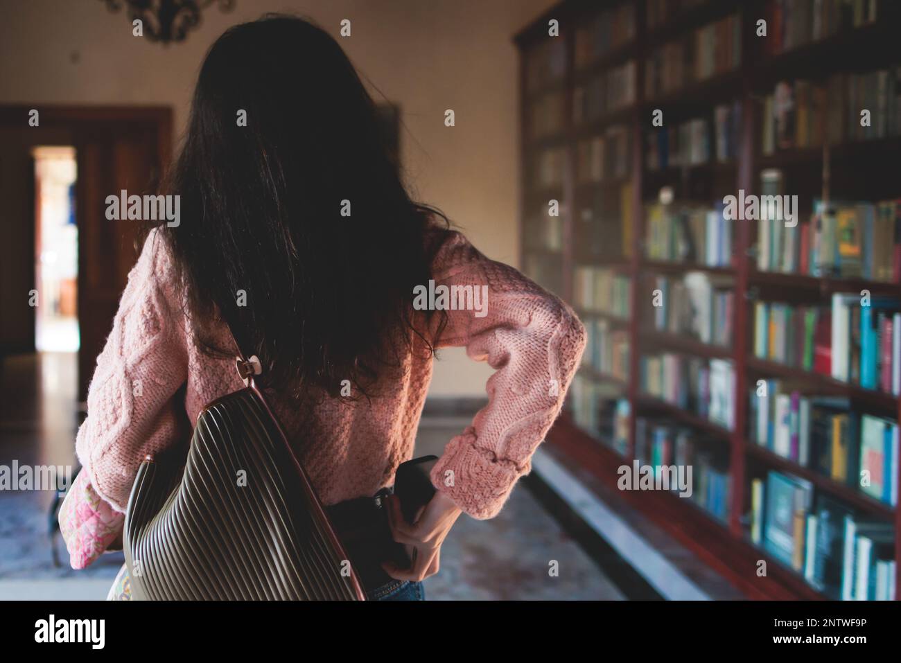 Student at the library, old university archive college interior with ...
