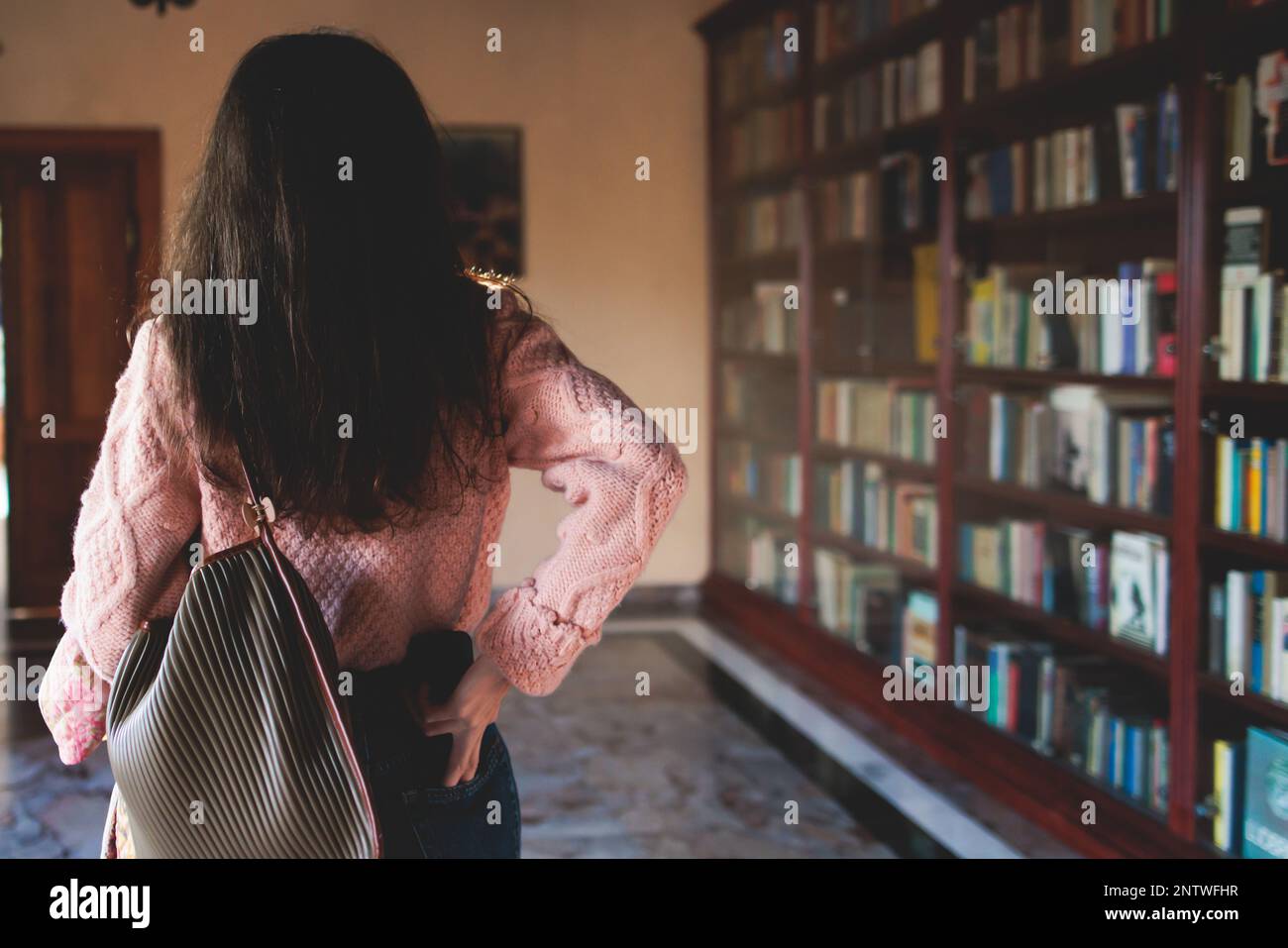 Student at the library, old university archive college interior with ...