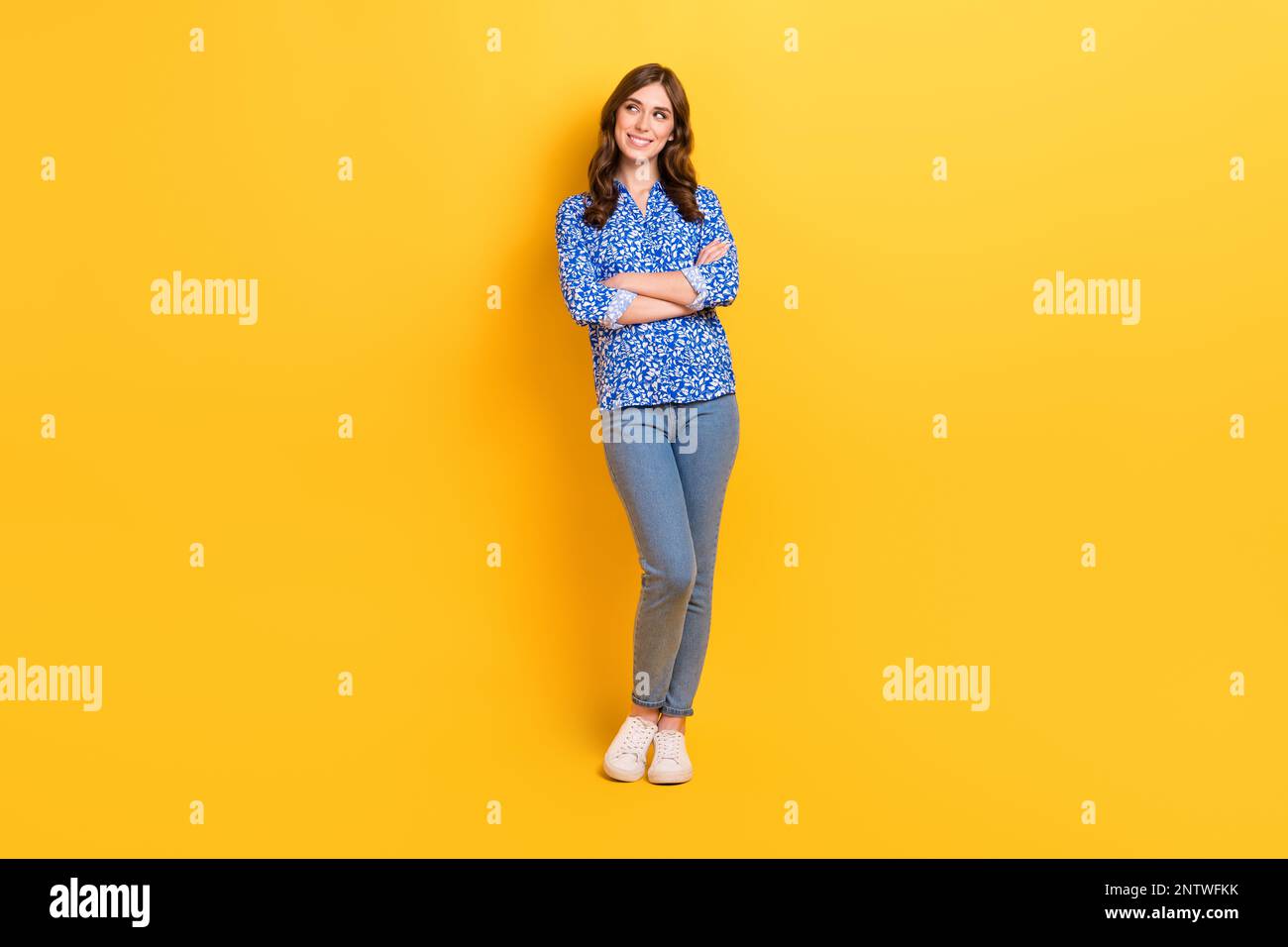 Full body photo of charming cheerful lady folded arms look empty space ...