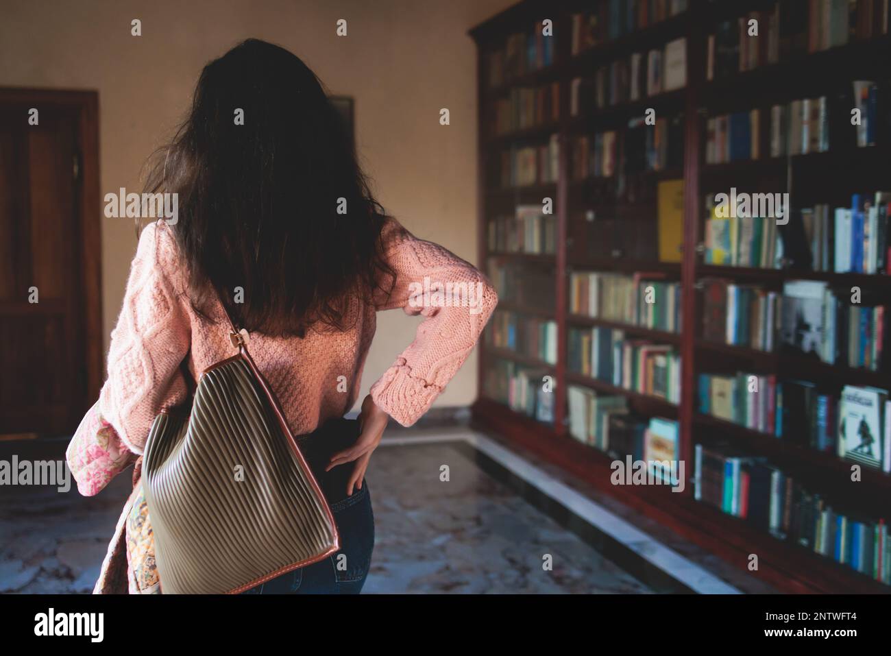 Student at the library, old university archive college interior with ...
