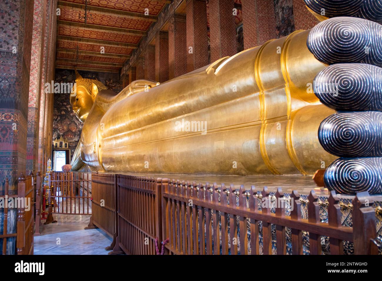 Gigantic Reclining Buddha statue in Wat Pho, Bangkok. Wat Pho is the oldest and largest temple ...