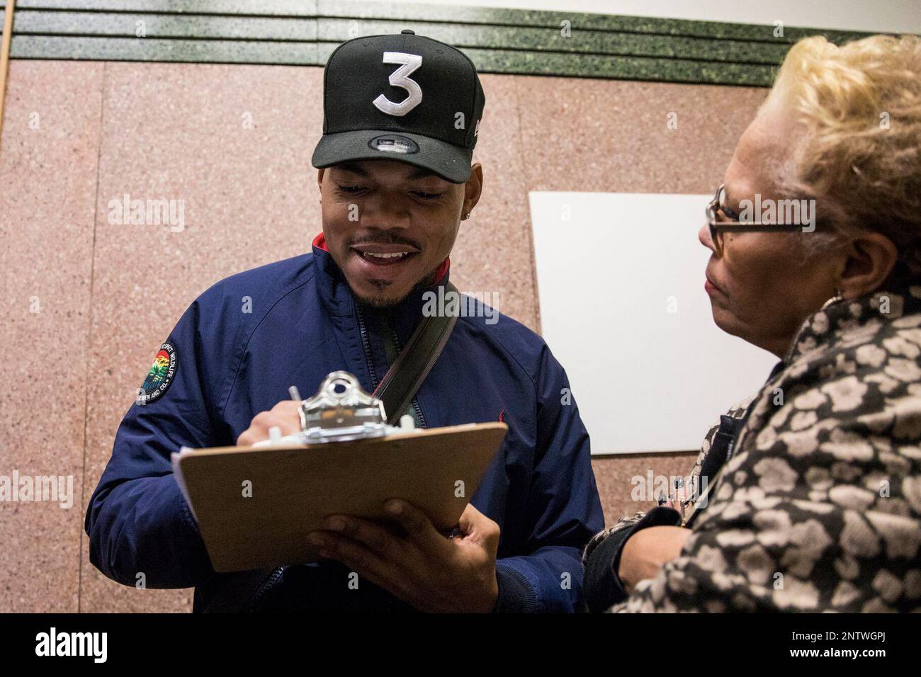 Chance The Rapper signs in to vote in the Chicago municipal election at ...