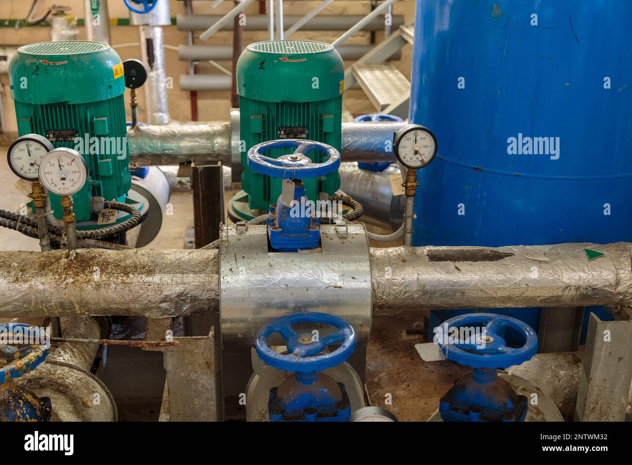 Electric pump with manometer. Pumping station in the basement with two ...