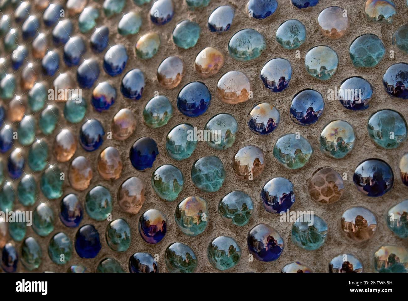 Closeup of mosaic background of round glass blue turquoise balls in ...