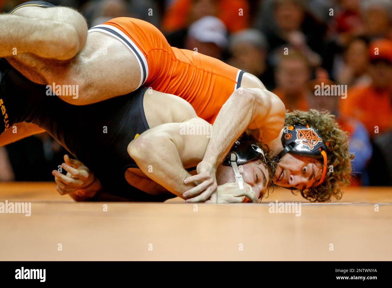 Oklahoma State's Daton Fix attempts to turn Iowa's Austin DeSanto ...