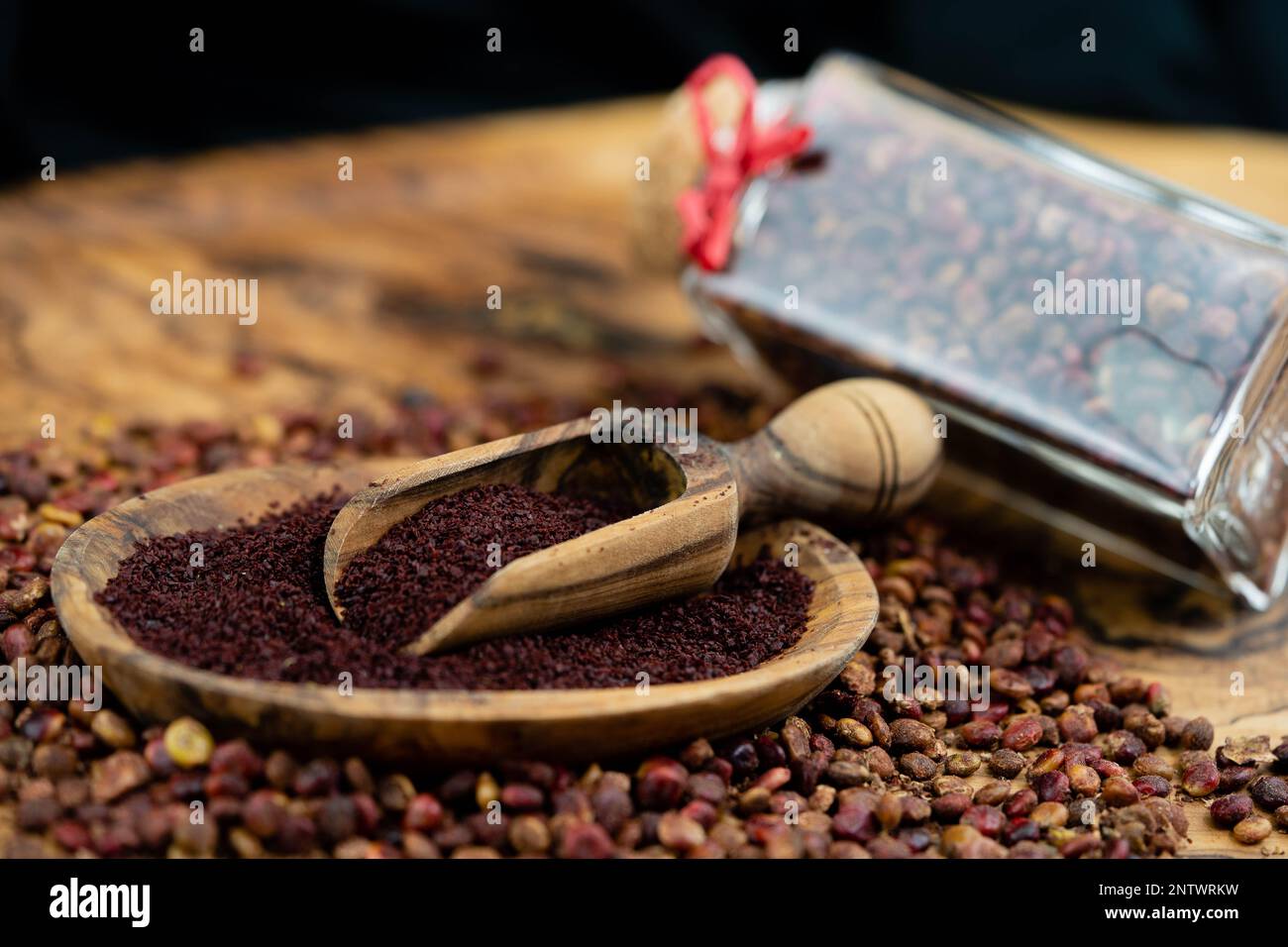 red Turkish Sumach rhus coriaria on olive wood Stock Photo - Alamy