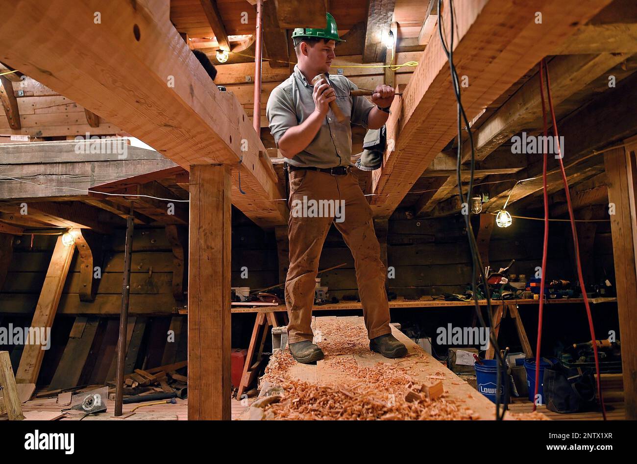 Shipwright Tom Desocio mitres a deck beam on the Mayflower II Thursday ...