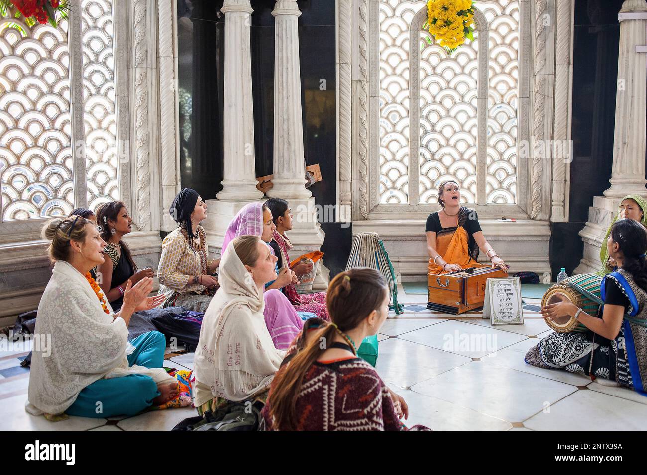Group of women praying, in ISKCON temple, Sri Krishna Balaram Mandir ...