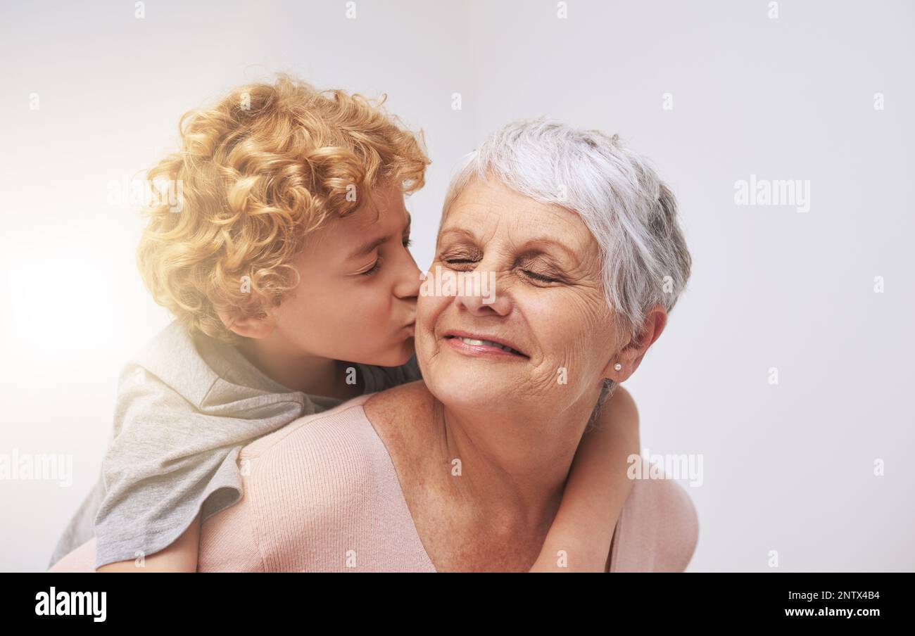 Love You So Much Granny Shot Of A Little Boy Giving His Grandmother A 2018