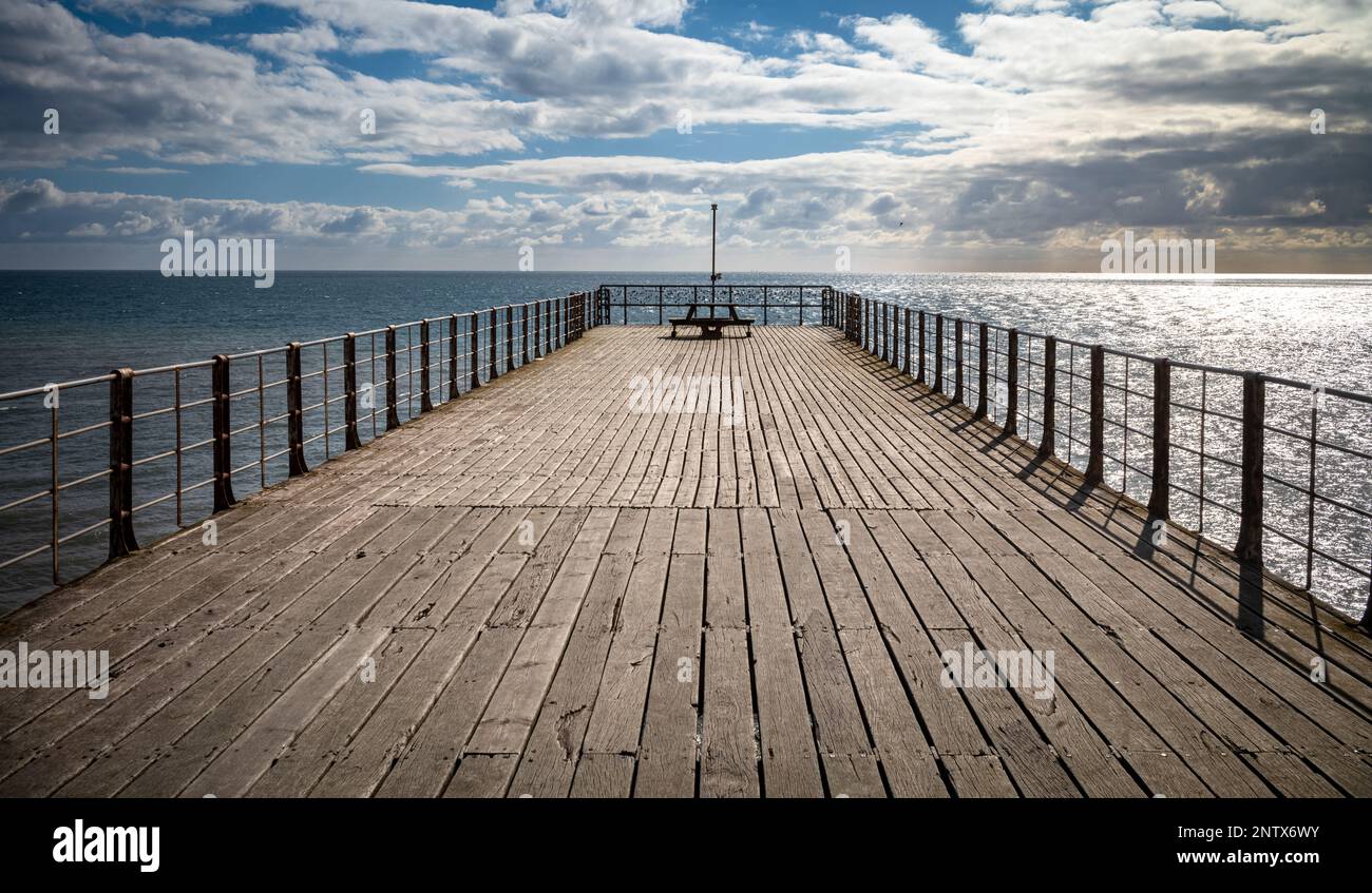 A view down Bognor Regis Pier in West Sussex, UK, looking out across ...