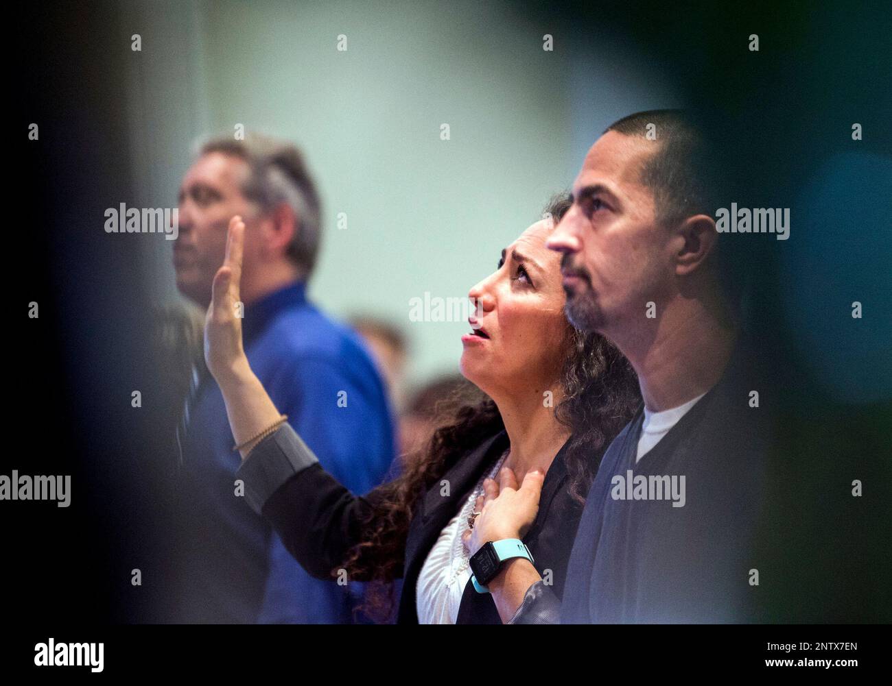 Mother Tamara Linkowski looks up as she prays, touching her heart as ...
