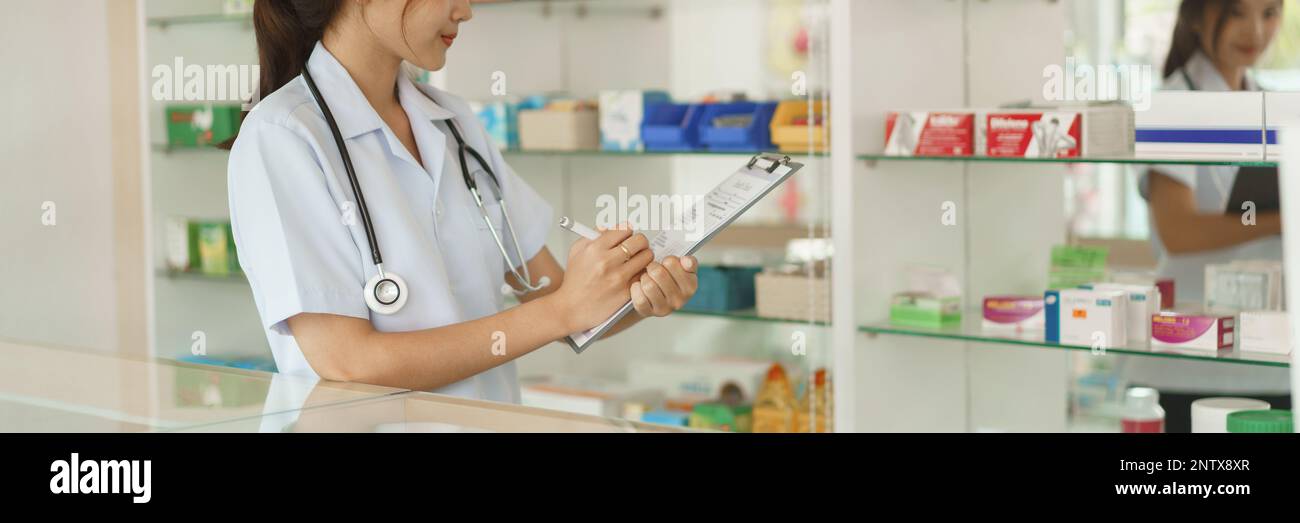 Medicine and health concept, Female pharmacist checking medicine on ...