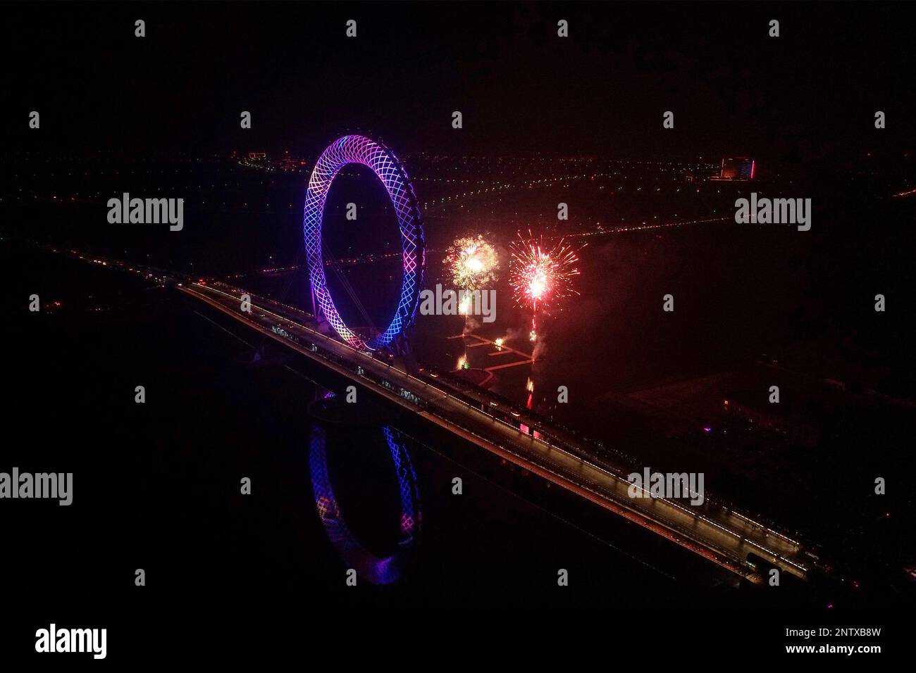 A Ferris wheel called Eye of Bohai changes color in the night of ...