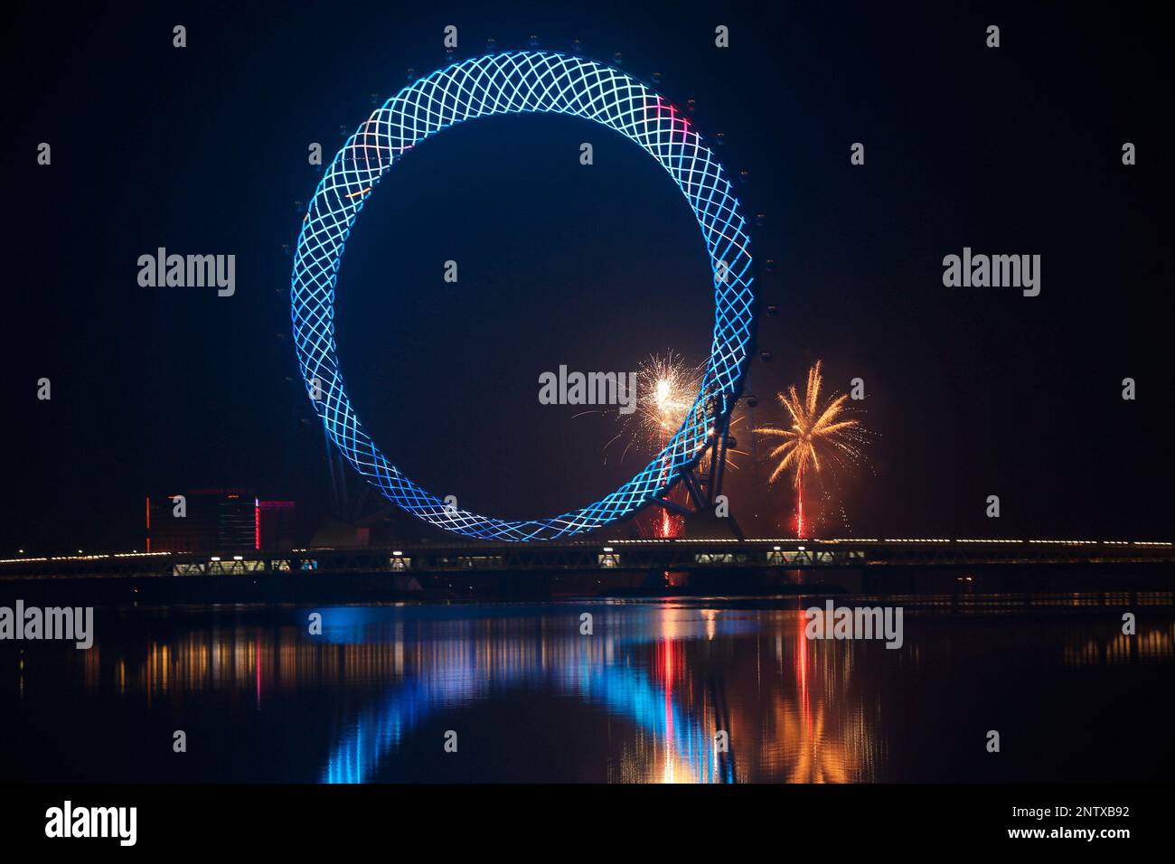 A Ferris wheel called Eye of Bohai changes color in the night of ...