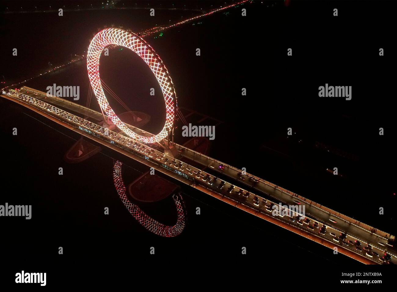A Ferris wheel called Eye of Bohai changes color in the night of ...