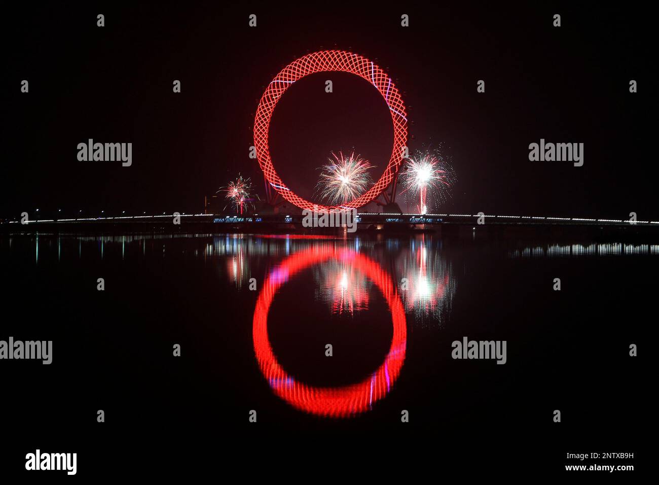 A Ferris wheel called Eye of Bohai changes color in the night of ...