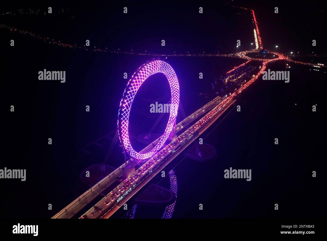 A Ferris wheel called Eye of Bohai changes color in the night of ...