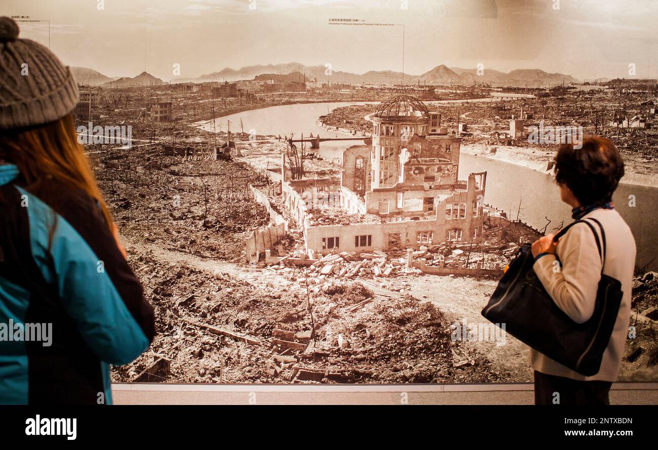 visitors looks a photo of Hiroshima after the atomic bomb explosion, Hiroshima Peace Memorial ...