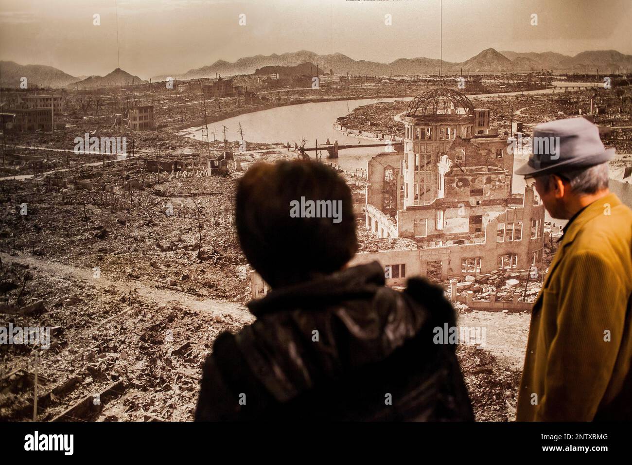 visitors looks a photo of Hiroshima after the atomic bomb explosion ...