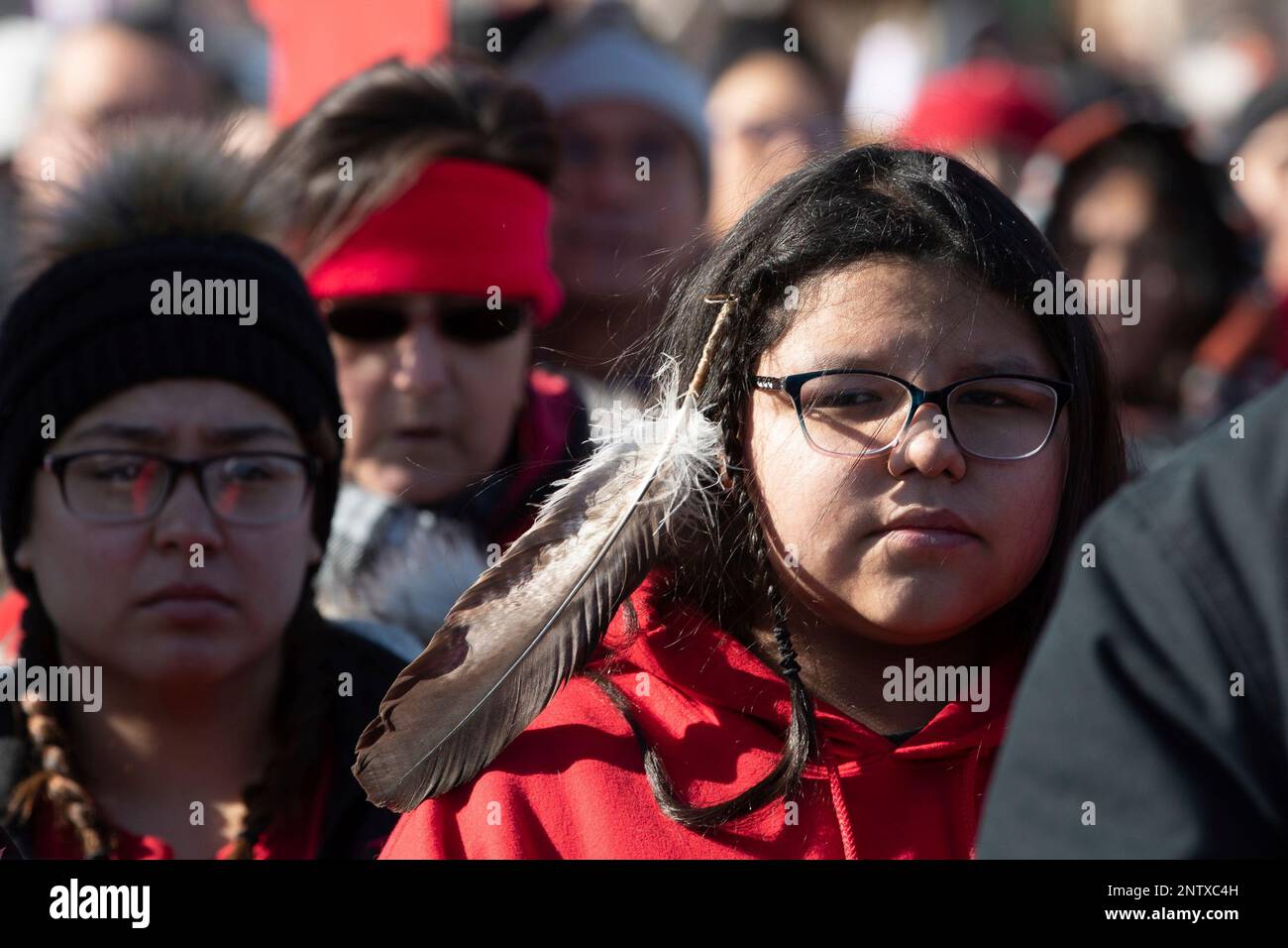 People participate in a march in downtown Rapid City, S.D., on Thursday, Feb. 14, 2019, to call ...