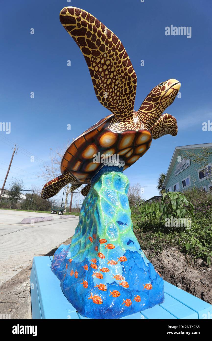 In this Wednesday, Feb. 13, 2019 photo, a sea turtle statue is ...