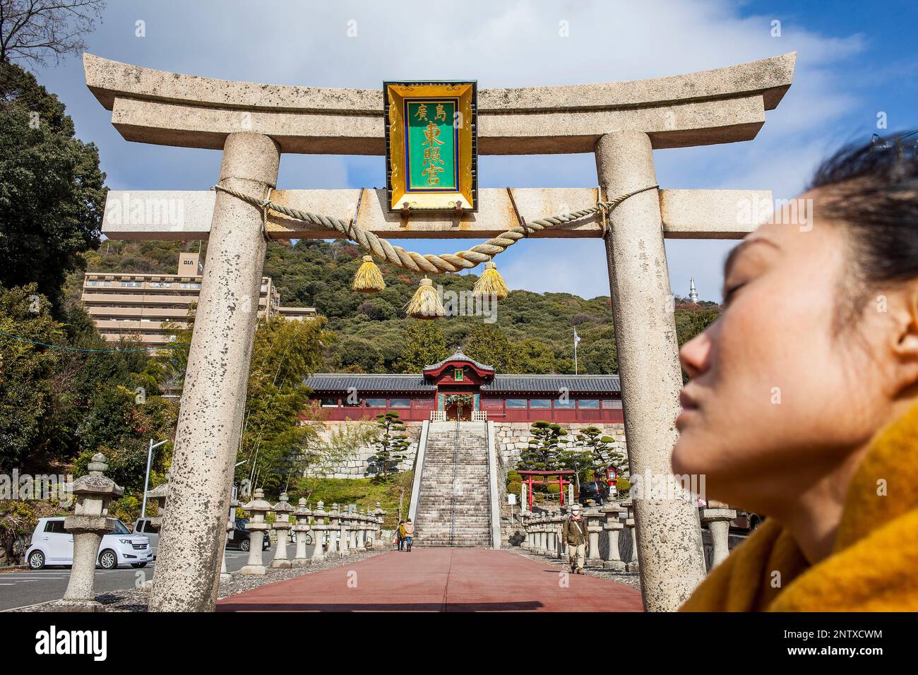 Toshogu Shrine and woman praying, Hiroshima, Japan Stock Photo - Alamy
