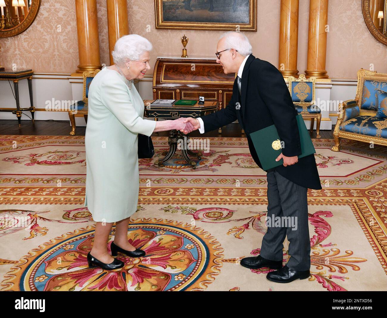 Queen Elizabeth II shakes hands with Fred Arruda the Ambassador of ...