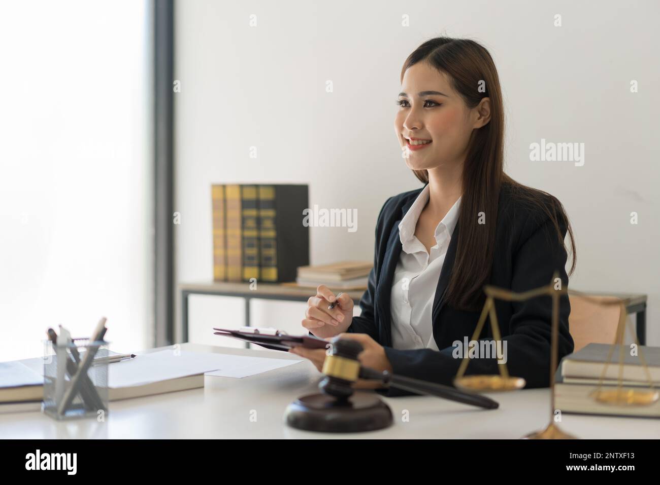 Legal and justice concept, Female lawyer writing contract about ...