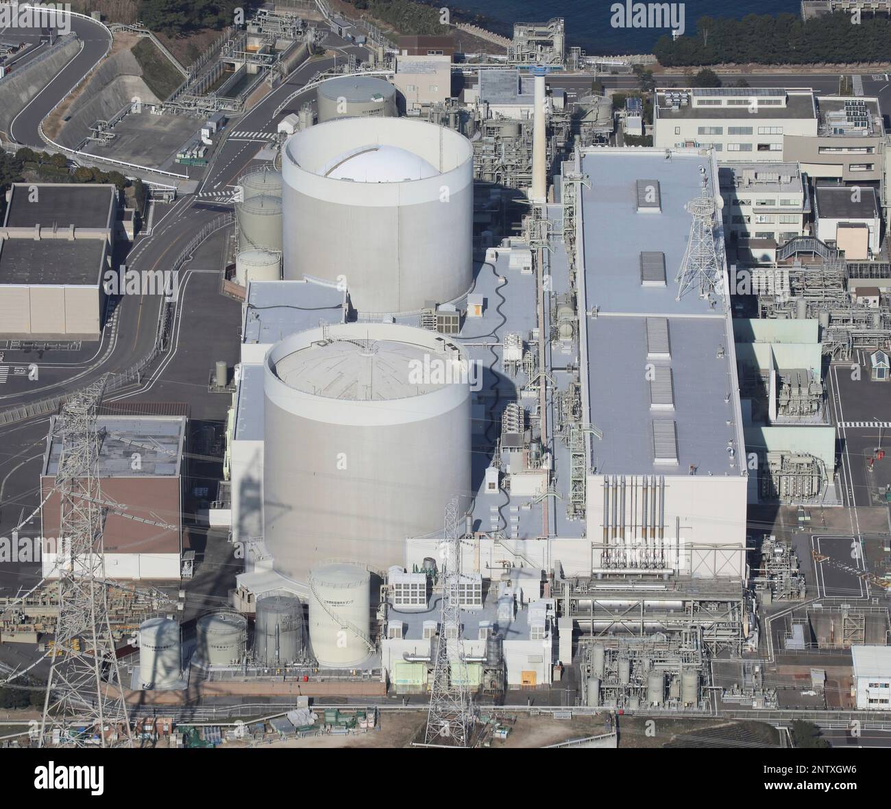 An aerial photo shows 1st reactor (rear) and 2nd reactor at Genkai ...