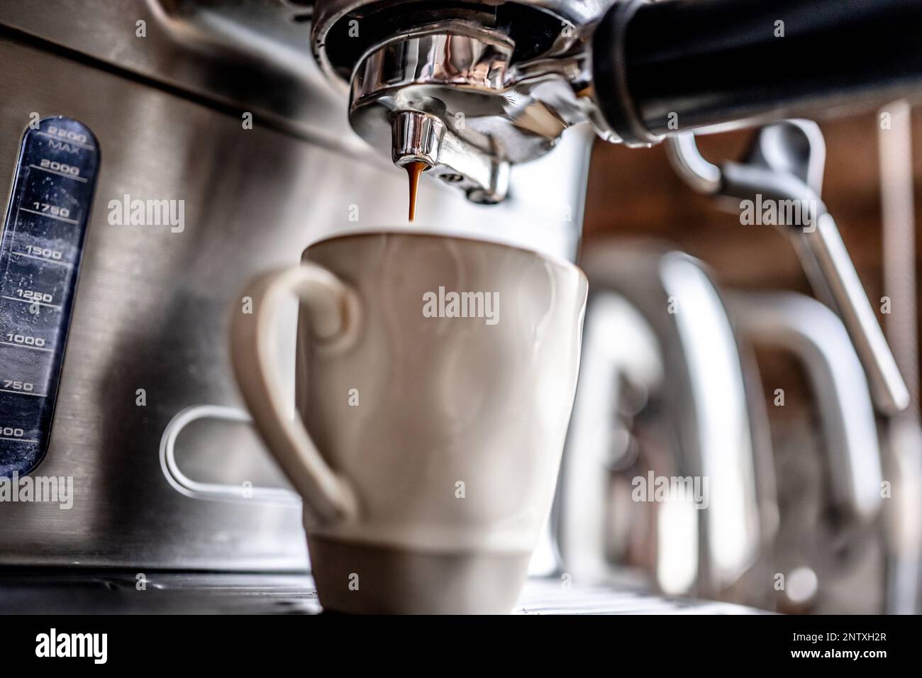 Coffee cappuccino preparation process with cafe maker Stock Photo - Alamy