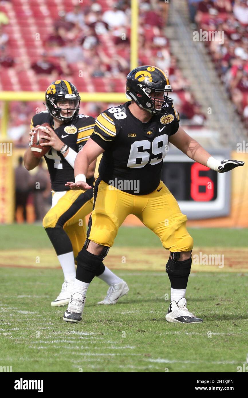 Iowa Hawkeyes offensive lineman Keegan Render (69) blocks a defender in ...