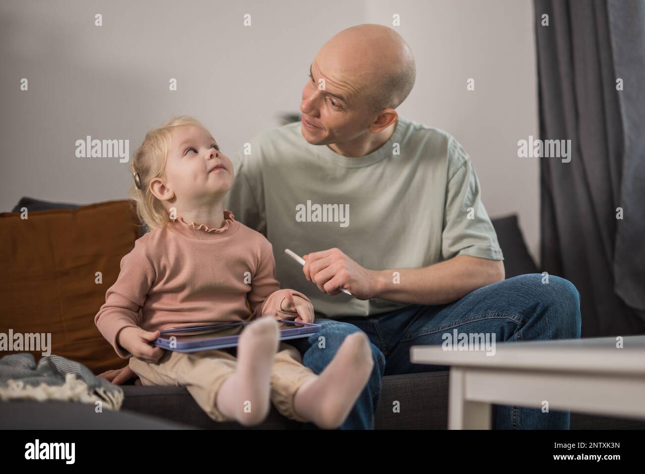 People with cochlear implant system. Kid study to hear with her funny ...