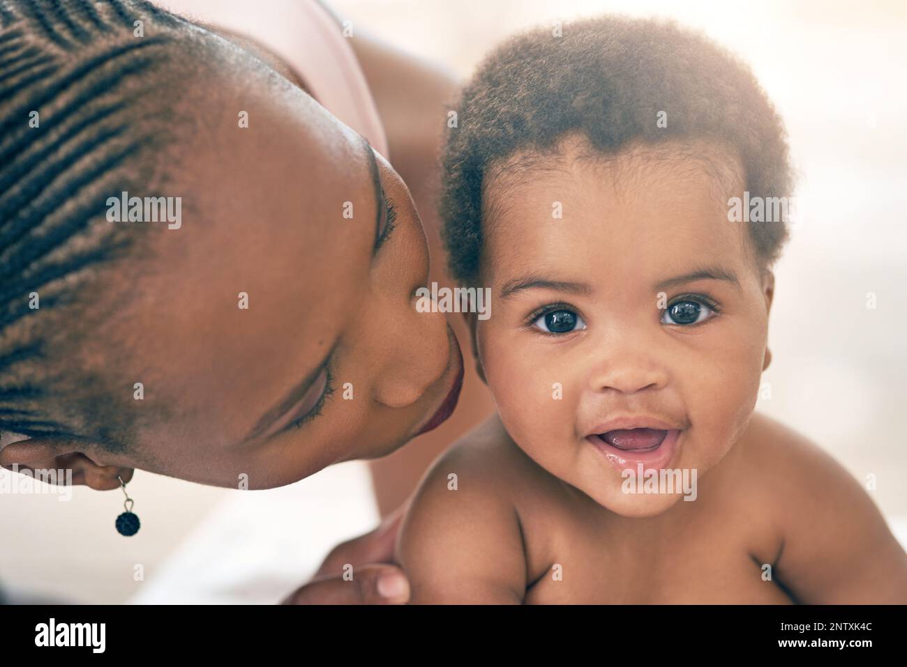 Mother with baby, face and hug with family, content and bonding with ...