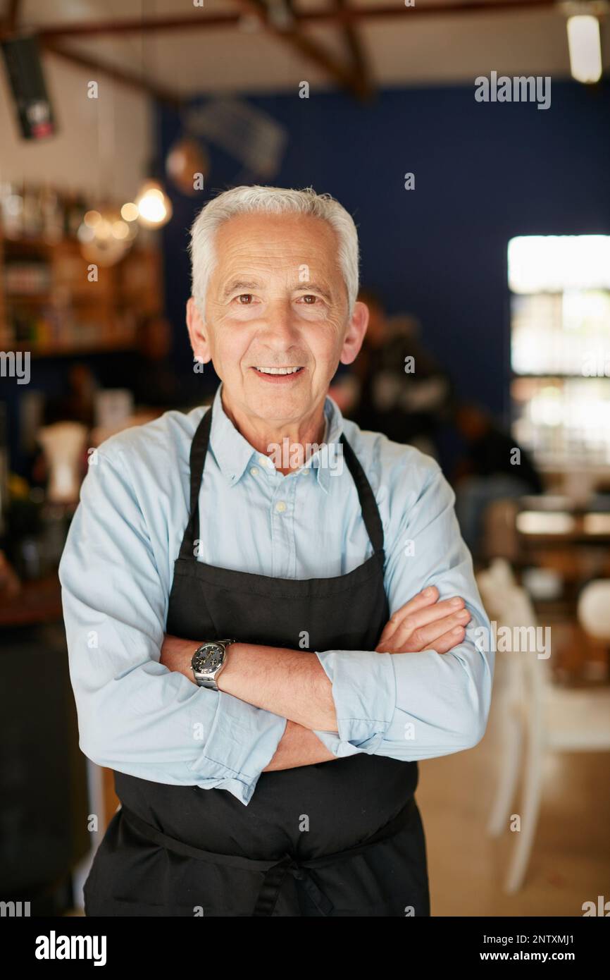 I quit the rat race to open my own cafe. Portrait of a senior man ...