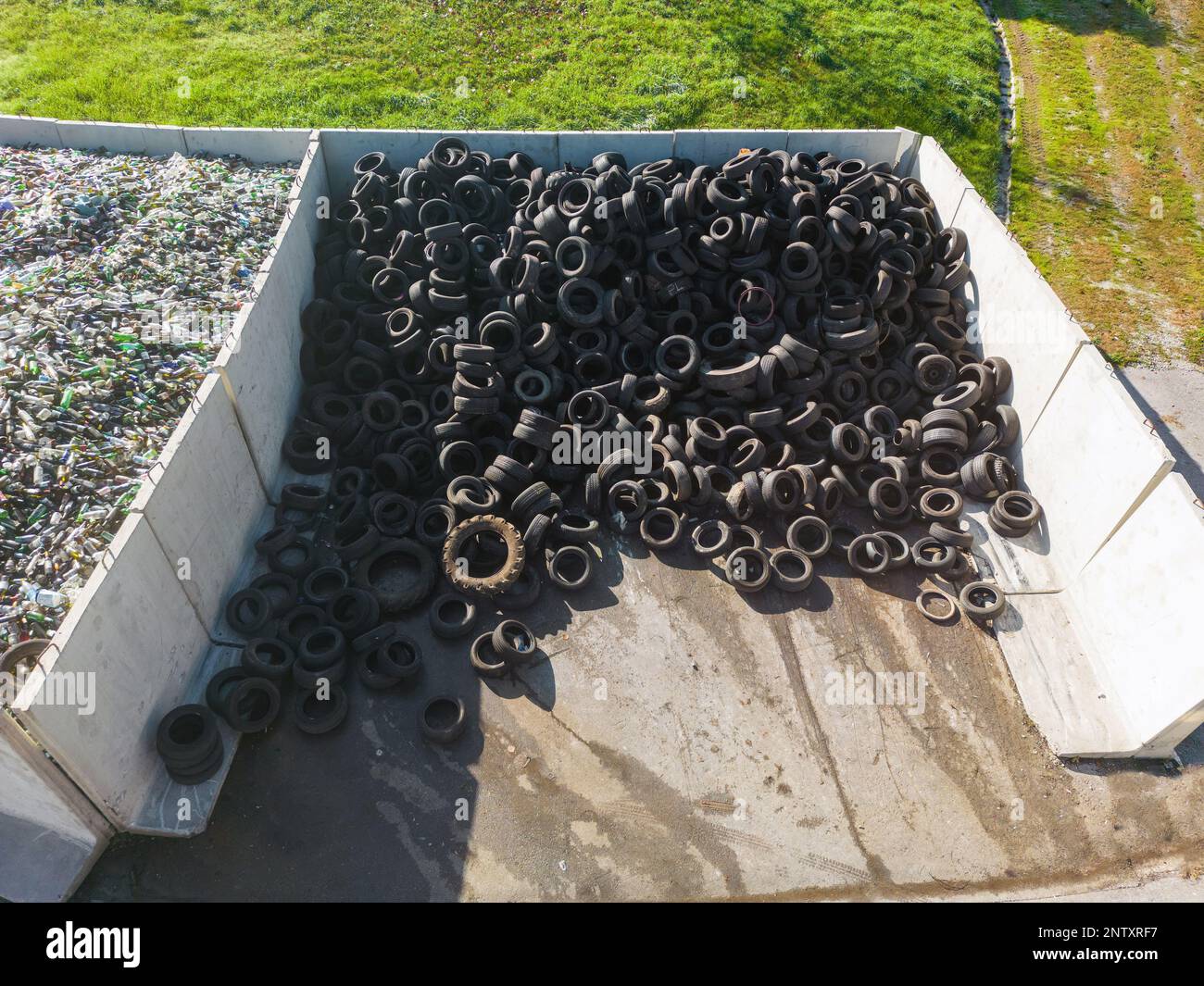 Waste disposal, a stack of end-of-life automobile and truck tires ...