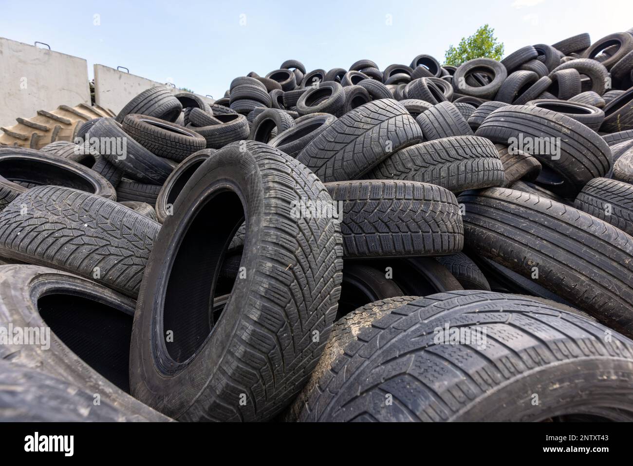 Waste disposal, a stack of end-of-life automobile and truck tires ...